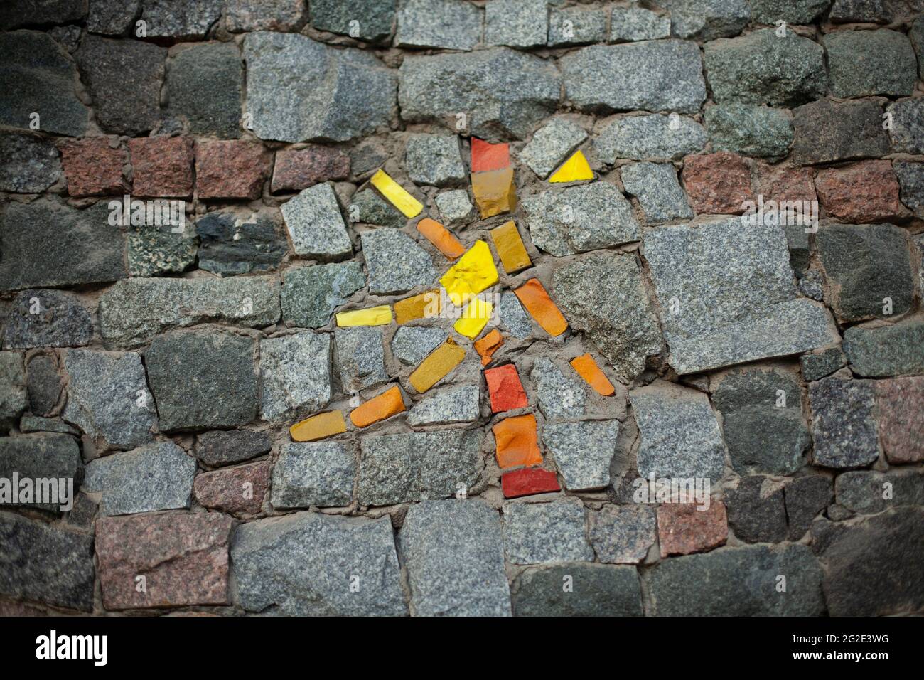 Details of the stone mosaic. Mosaic picture of pieces of stone. An ...