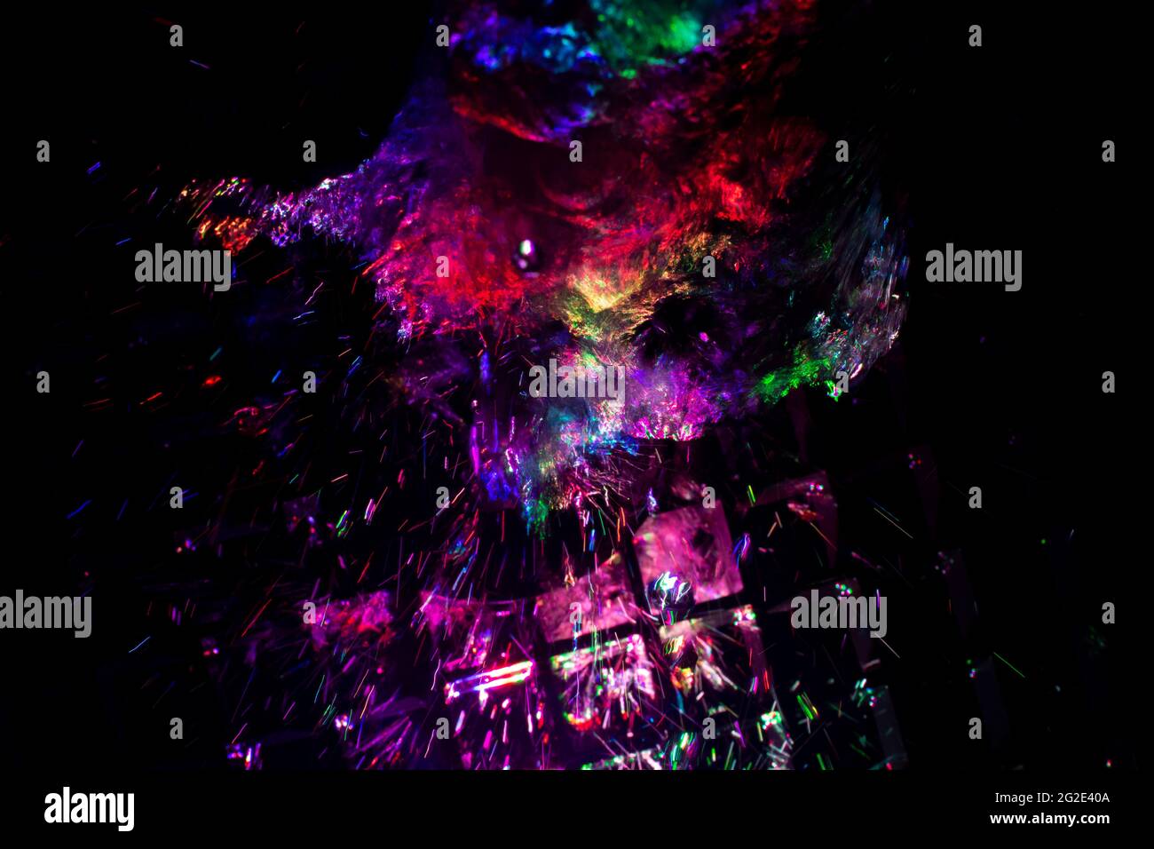 Colored water texture. Splashes of water lit in different colors. Close ...