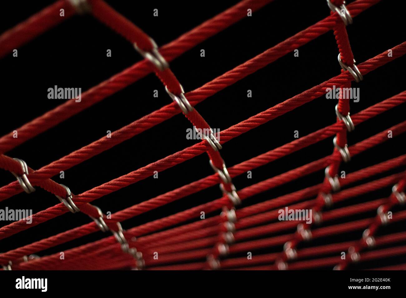 Ropes in the playground. Climbing net, shot close-up. Ropes fastened ...