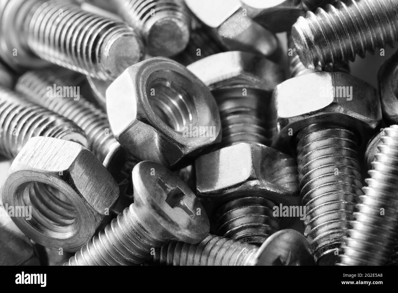 Abstract industrial textured metal background with many metal nuts and ...