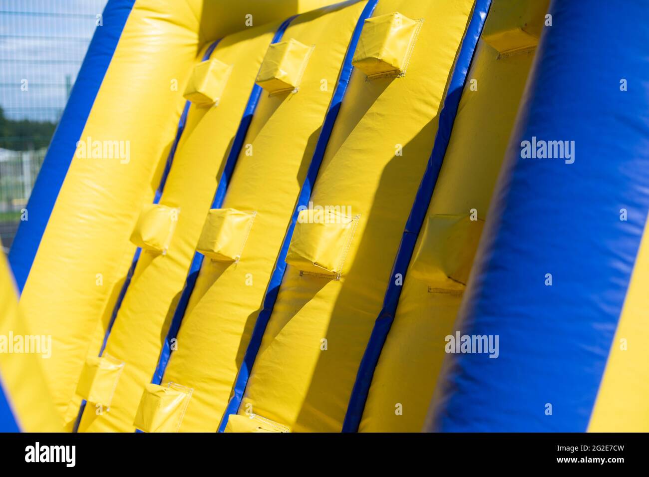 Inflatable obstacle course for fun. Inflatable structure in the park. A ...