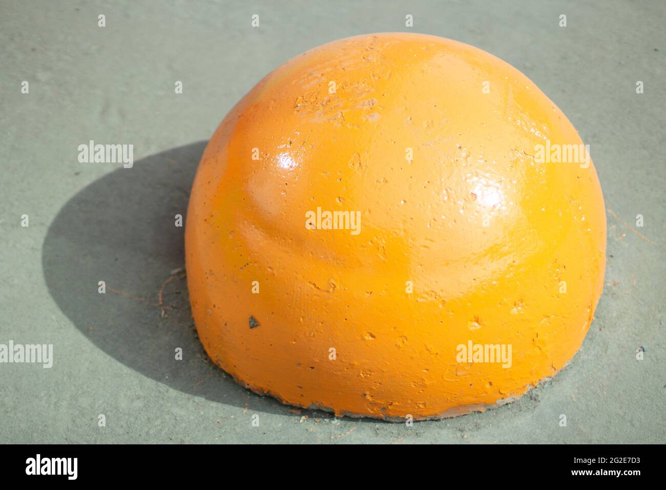 Parking spherical vehicle movement blocker. Orange traffic limiter ...