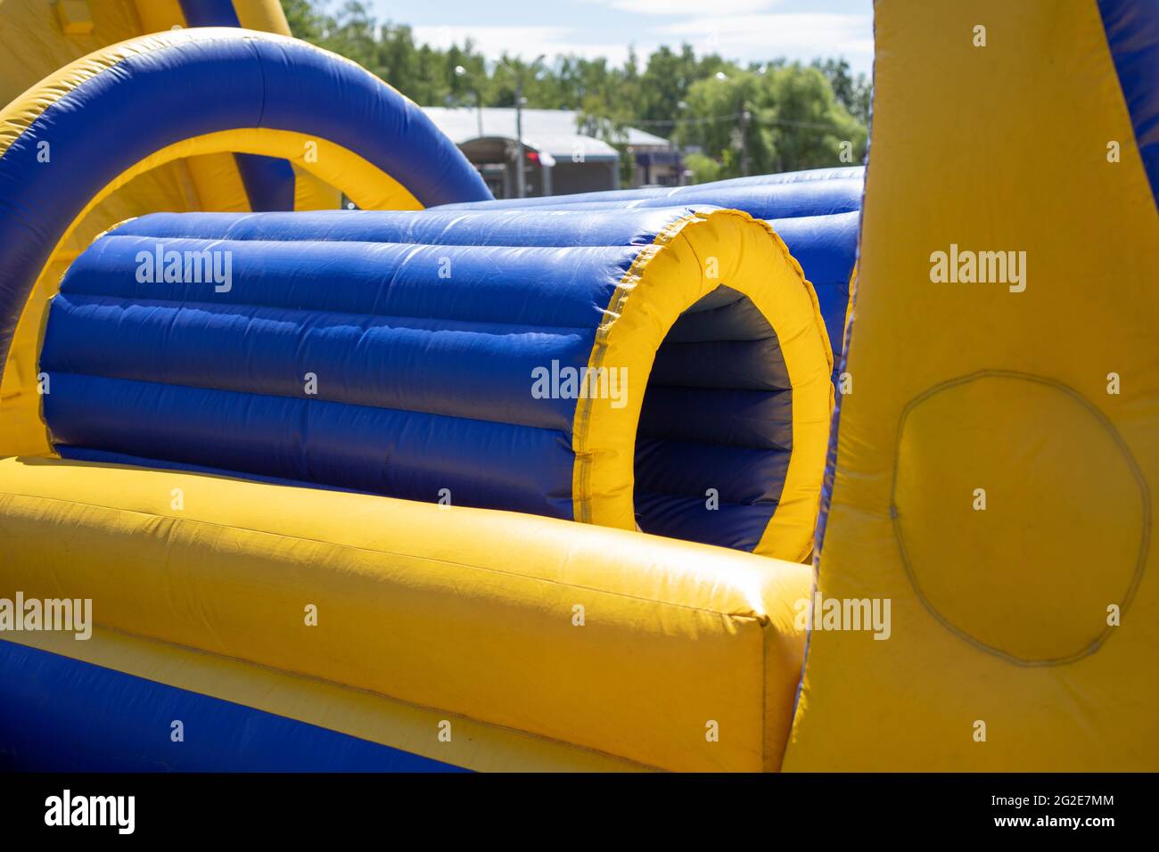 Inflatable obstacle course for fun. Inflatable structure in the park. A ...