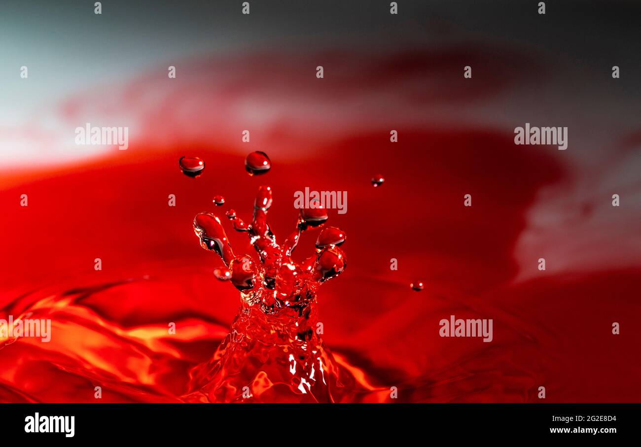 Representation of an explosion of coronavirus in red Stock Photo - Alamy