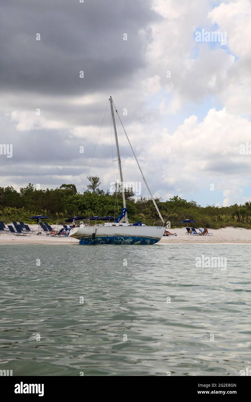 Shipwrecked sailboat on the beach of Clam Pass in Naples, Florida seen ...