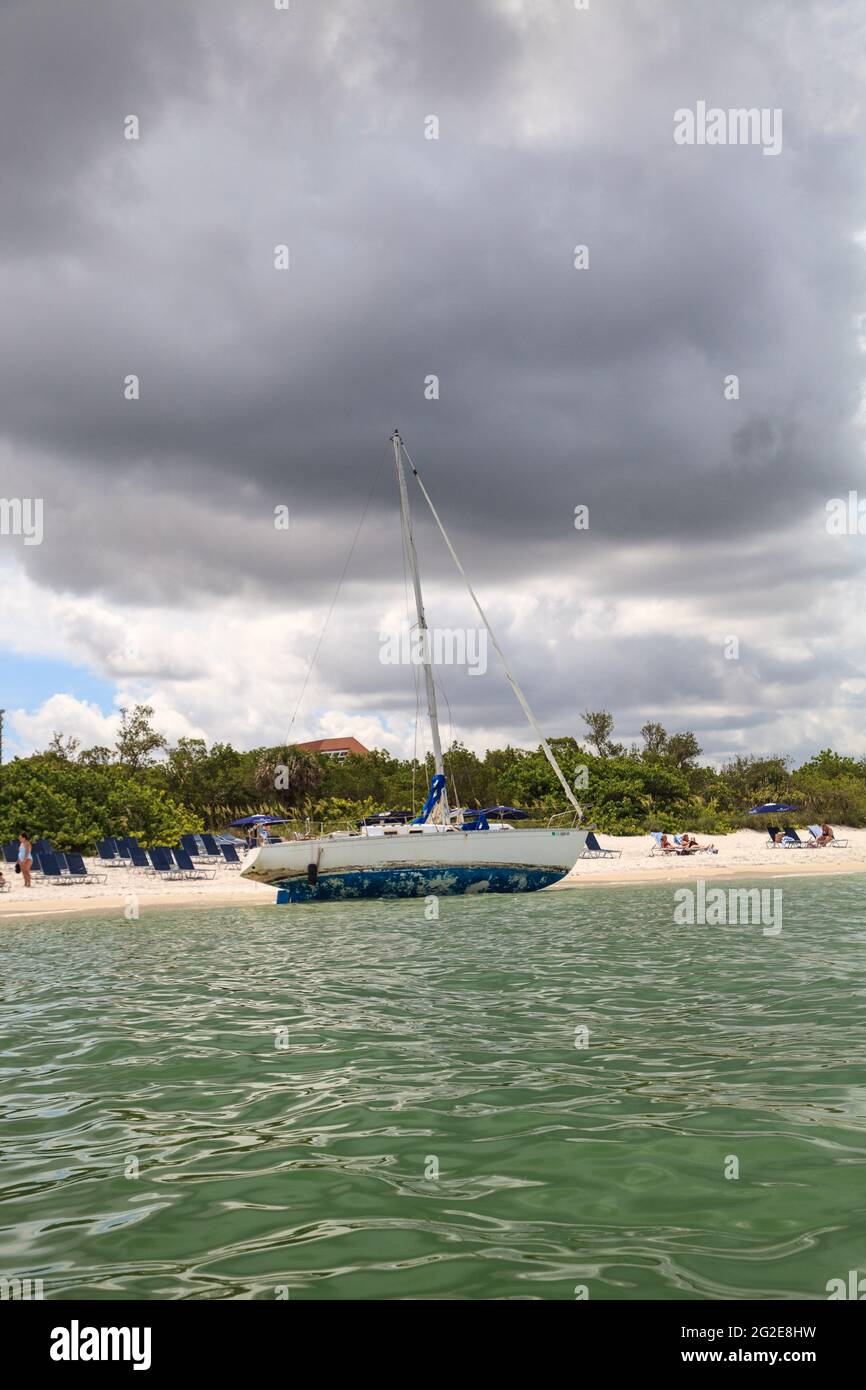 Shipwrecked sailboat on the beach of Clam Pass in Naples, Florida seen ...