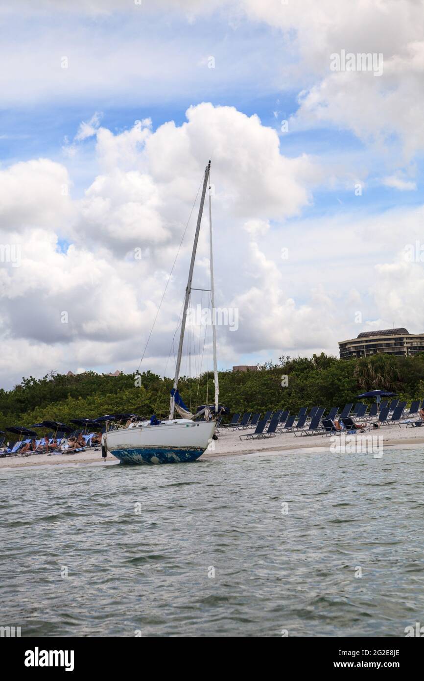 Shipwrecked sailboat on the beach of Clam Pass in Naples, Florida seen ...