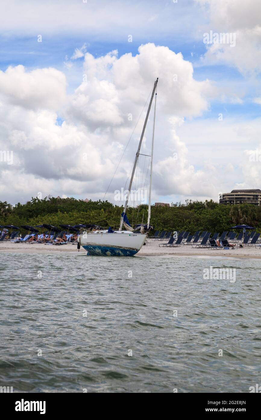 Shipwrecked sailboat on the beach of Clam Pass in Naples, Florida seen ...