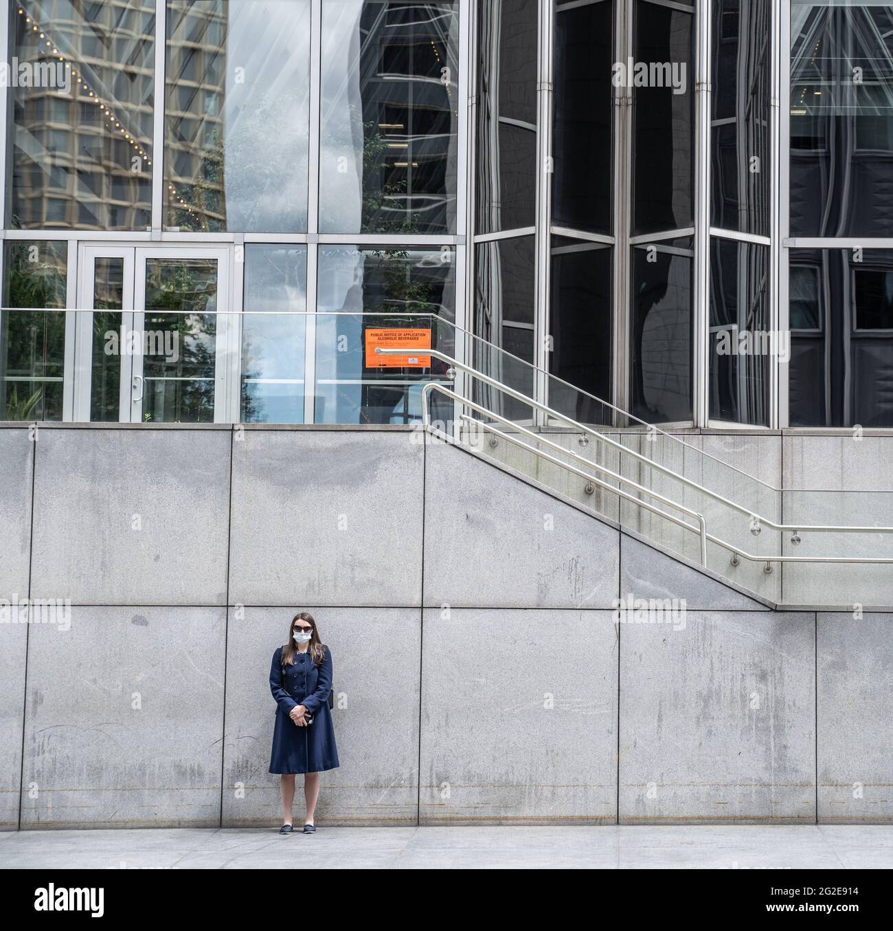 Woman standing bus stop hi-res stock photography and images - Alamy
