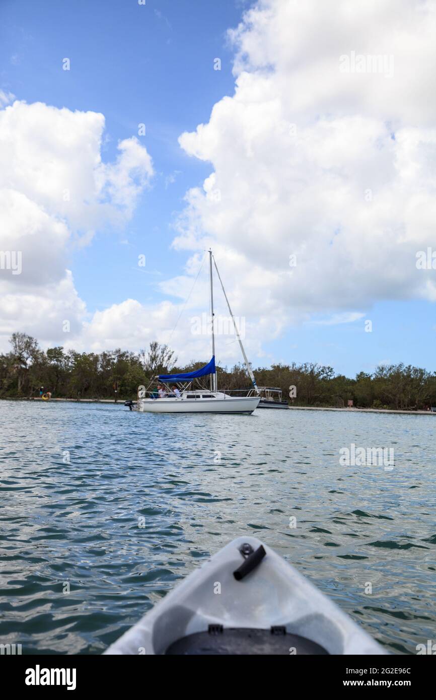 Sailboat gliding through Wiggins Pass in the Delnor Wiggins State Park ...