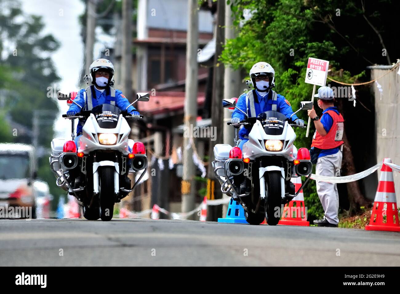 Police motorcycles are seen during the Tokyo 2020 Olympic torch relay ...