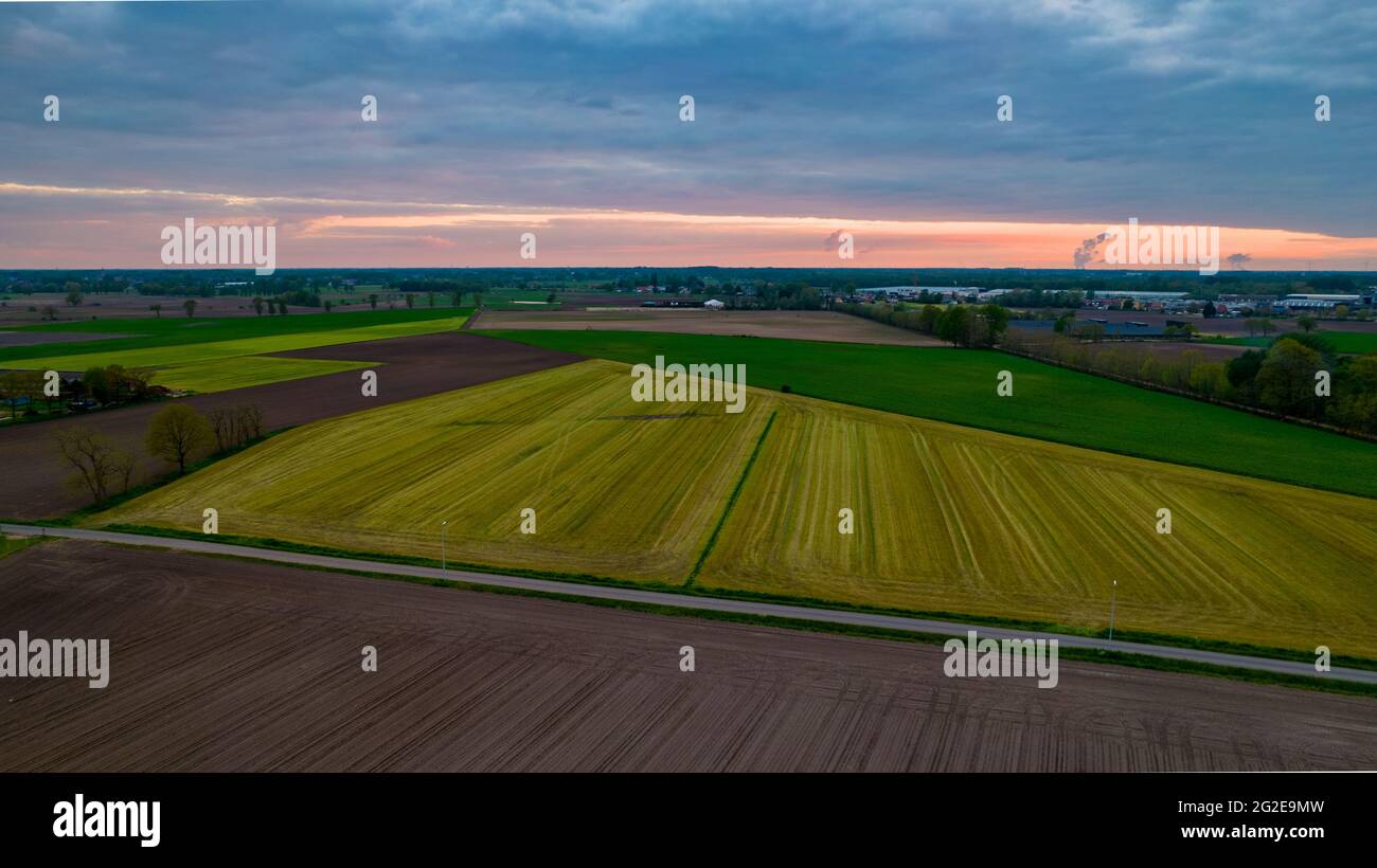 Sunset with dark and dramatic tthunderstorm clouds being split. The ...