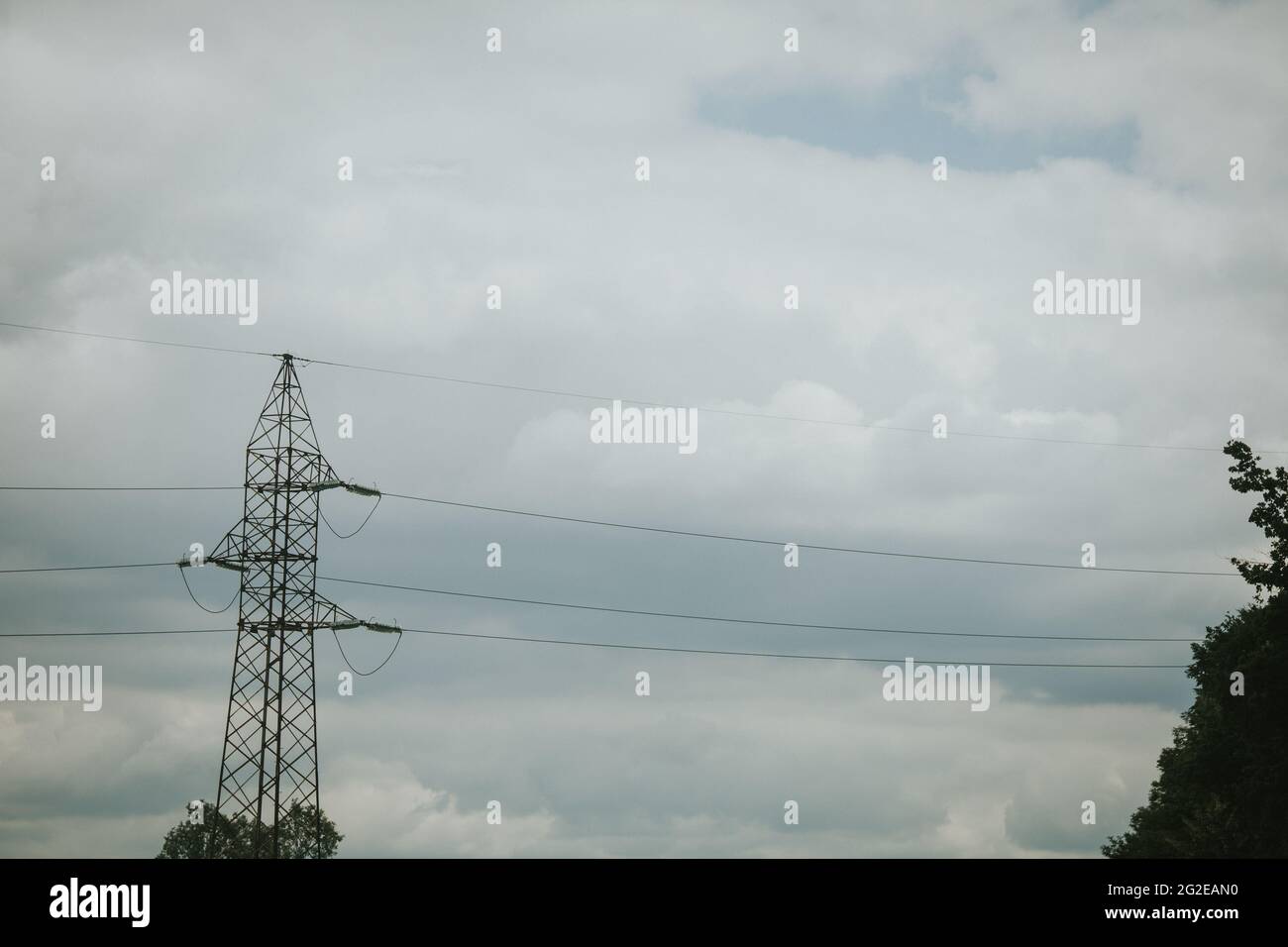 Cloudy sky above transmission towers and cables in the countryside Stock Photo - Alamy