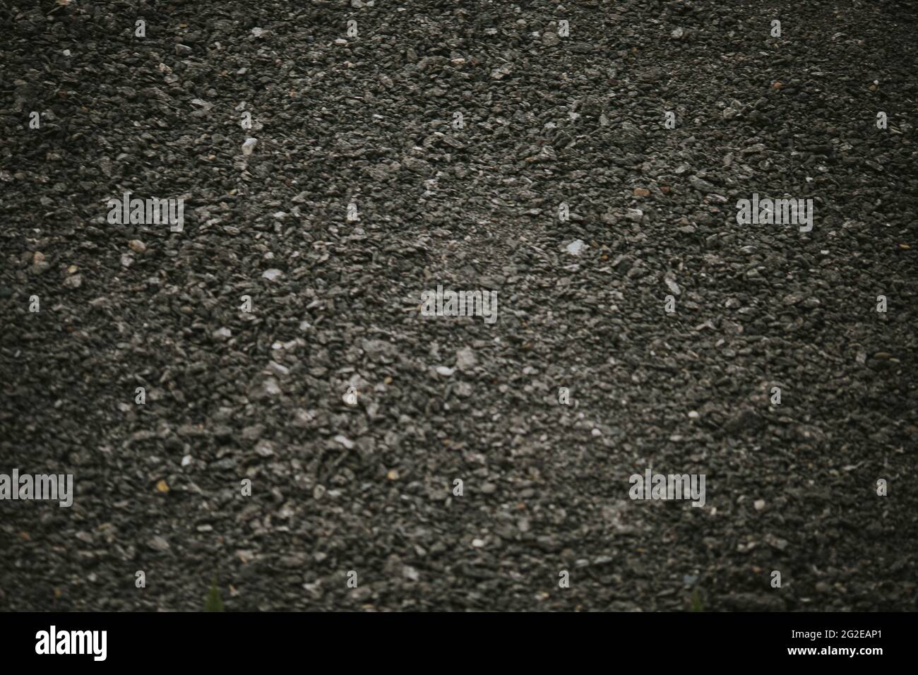 Gray background of the ground outside with small dark pebbles Stock ...