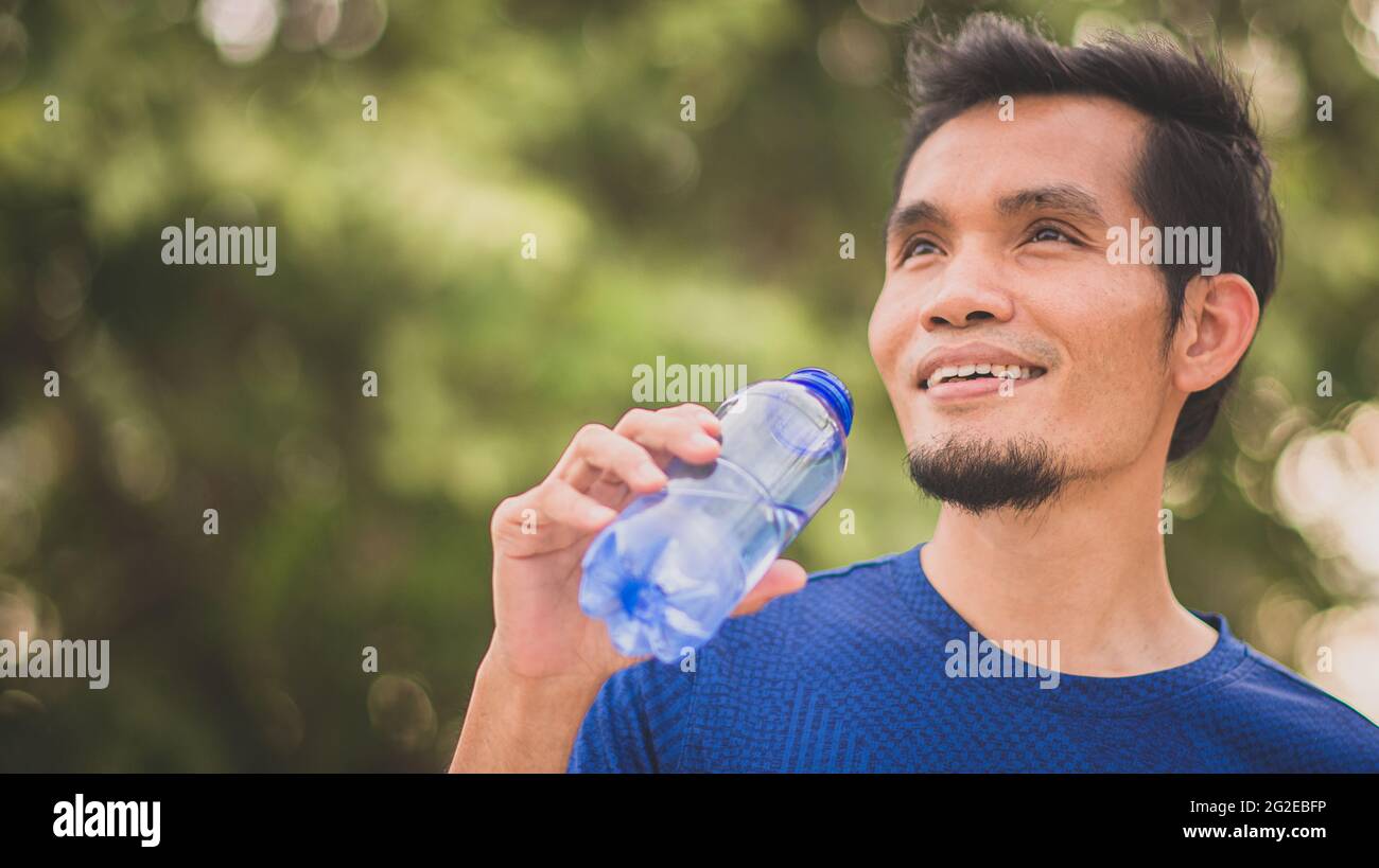 Man good health drink water happy smile Stock Photo - Alamy