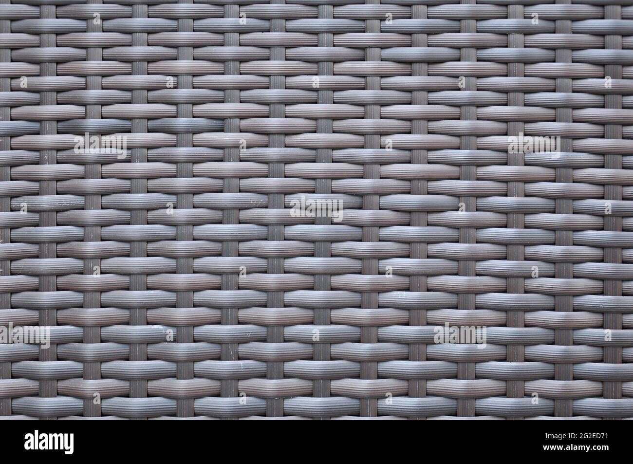 Dark brown woven rattan taxture background Stock Photo - Alamy