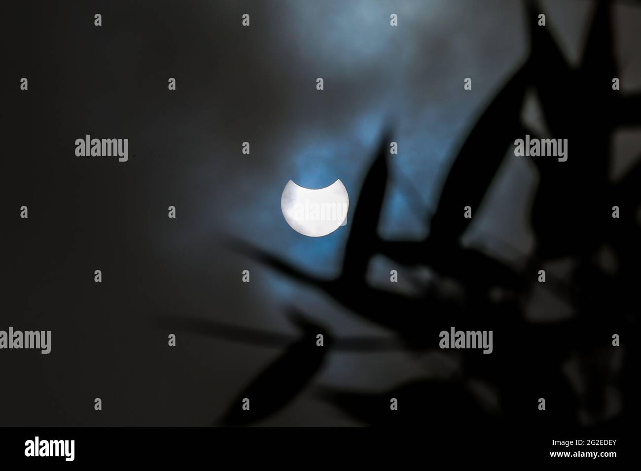 London, UK. 10th June, 2021. Partial Solar Eclipse seen over London as ...