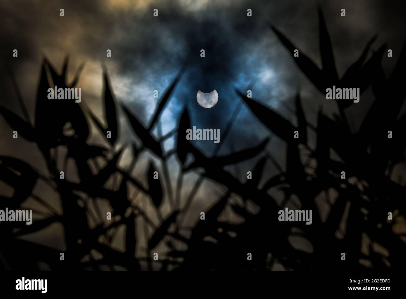 London, UK. 10th June, 2021. Partial Solar Eclipse seen over London as ...