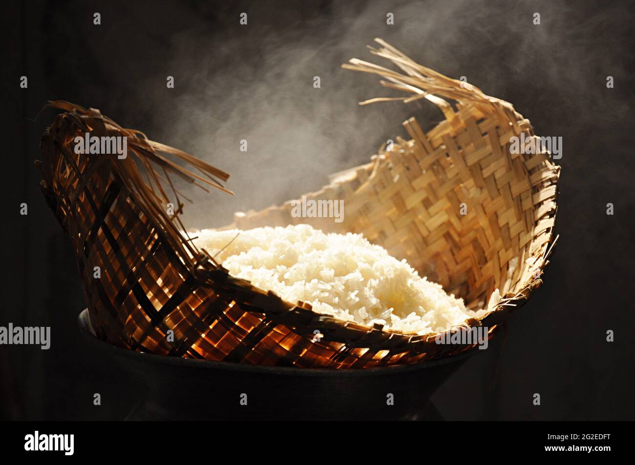 Sticky rice being cooked in wooden steamer Stock Photo - Alamy
