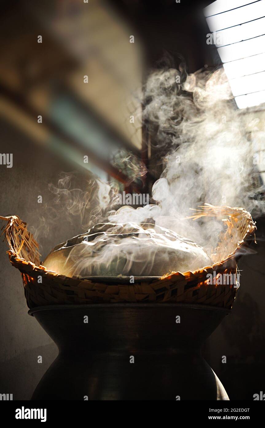 Sticky rice being cooked in wooden steamer Stock Photo - Alamy