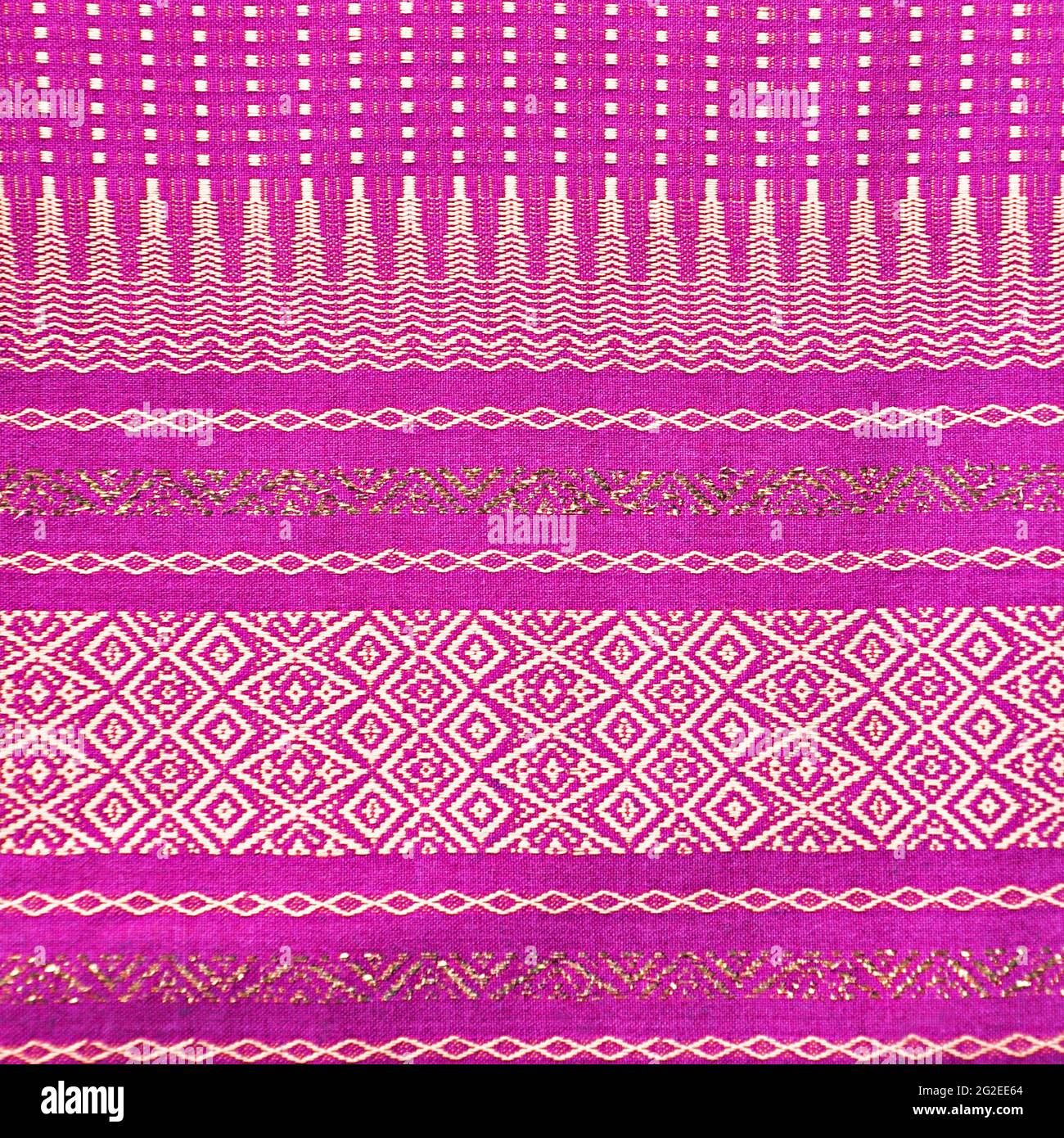 Thai style violet fabric pattern background Stock Photo - Alamy