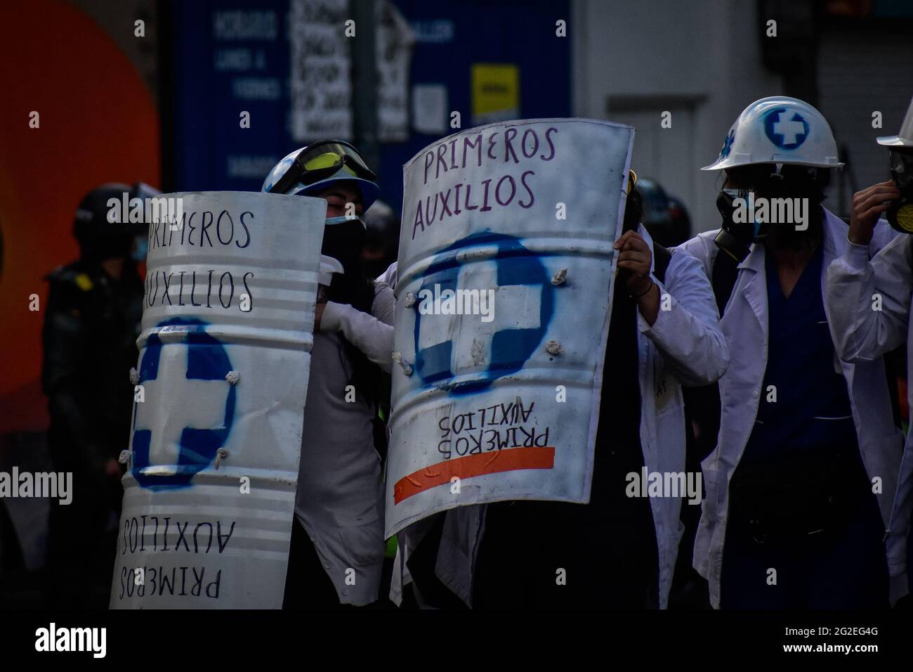 Members of a medical team protect themselves with handcrafted shields ...