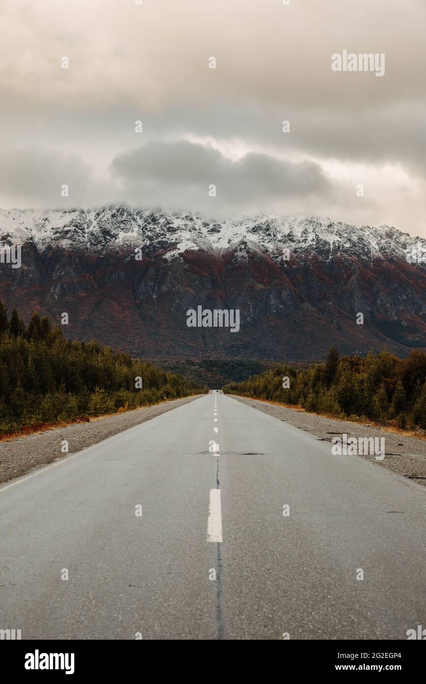 Empty asphalt road through the wild nature Stock Photo - Alamy