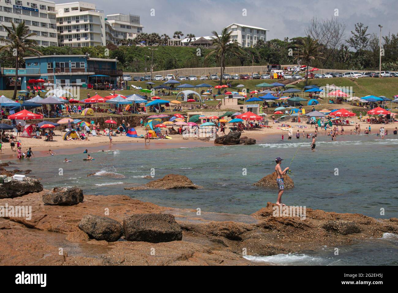 Holiday makers enjoying the sea and sun at scottburgh, south africa ...