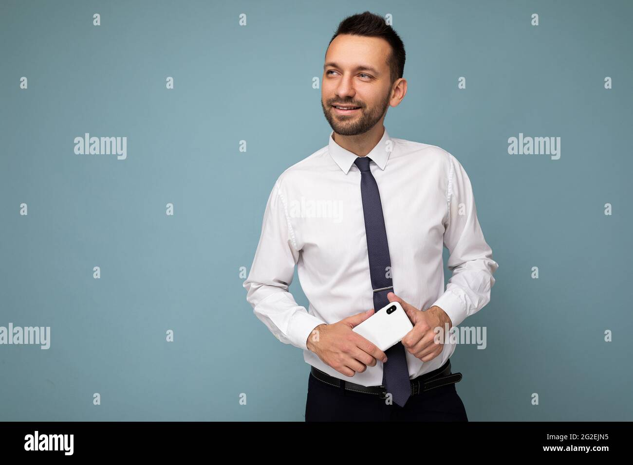 Handsome positive thoughtful good looking brunet unshaven man with ...