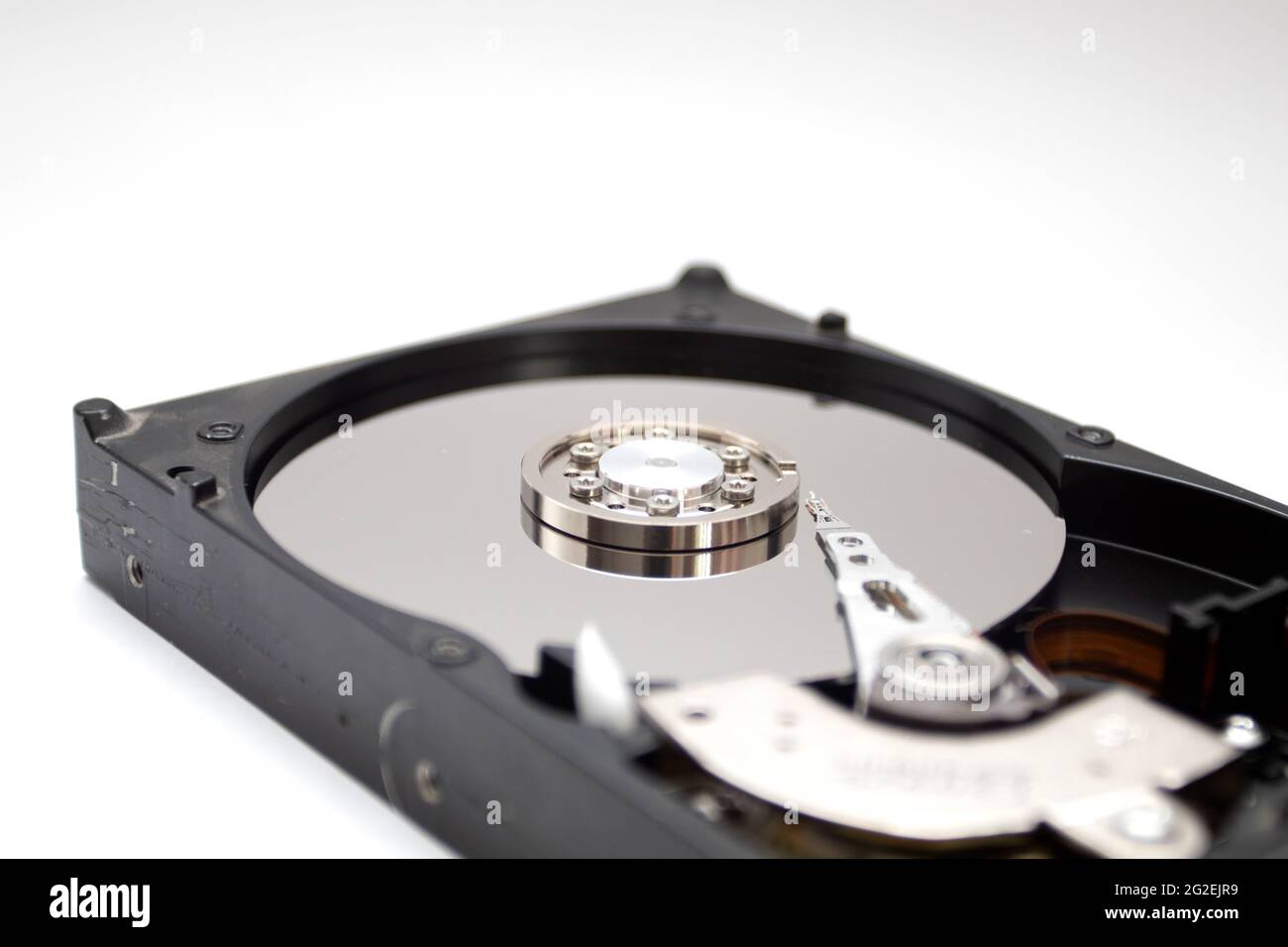 A hard disk drive isolated on white background. Closeup of opened HDD ...