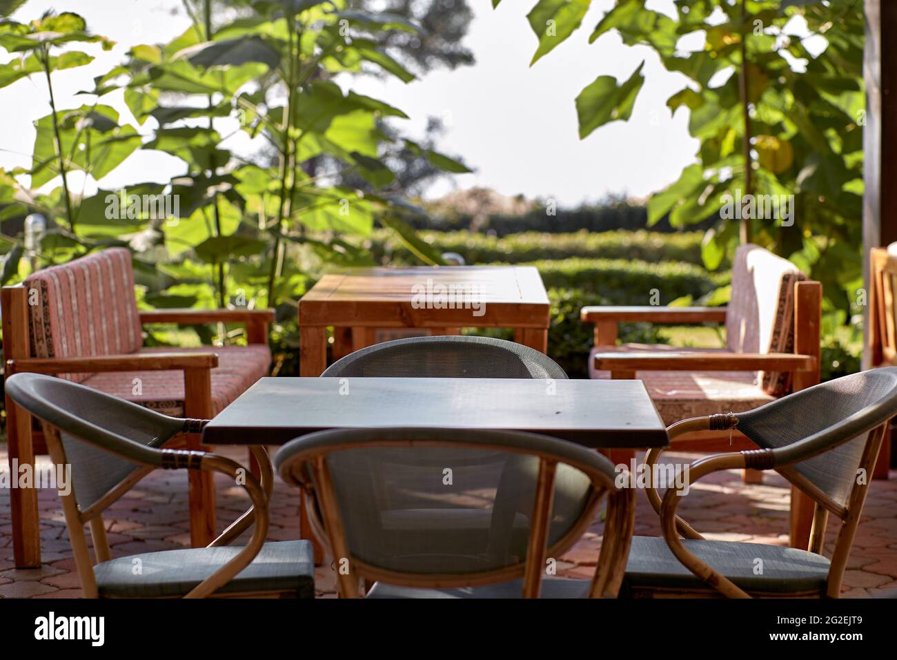 Beach bar, tables and chairs in bright sunny weather. Summer and ...