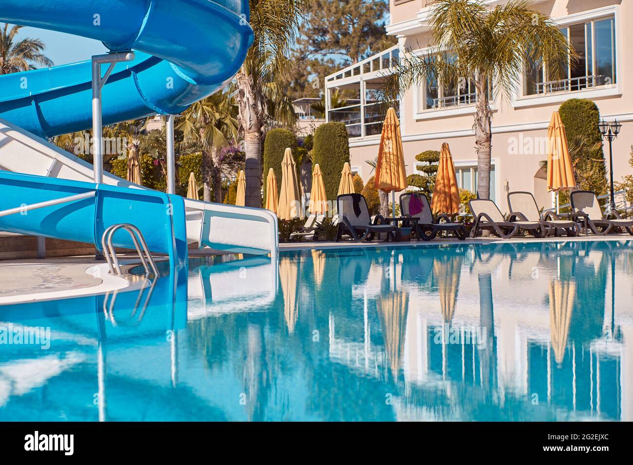 Kemer, Turkey - May, 21: Beautiful bright summer swimming pool with sun ...