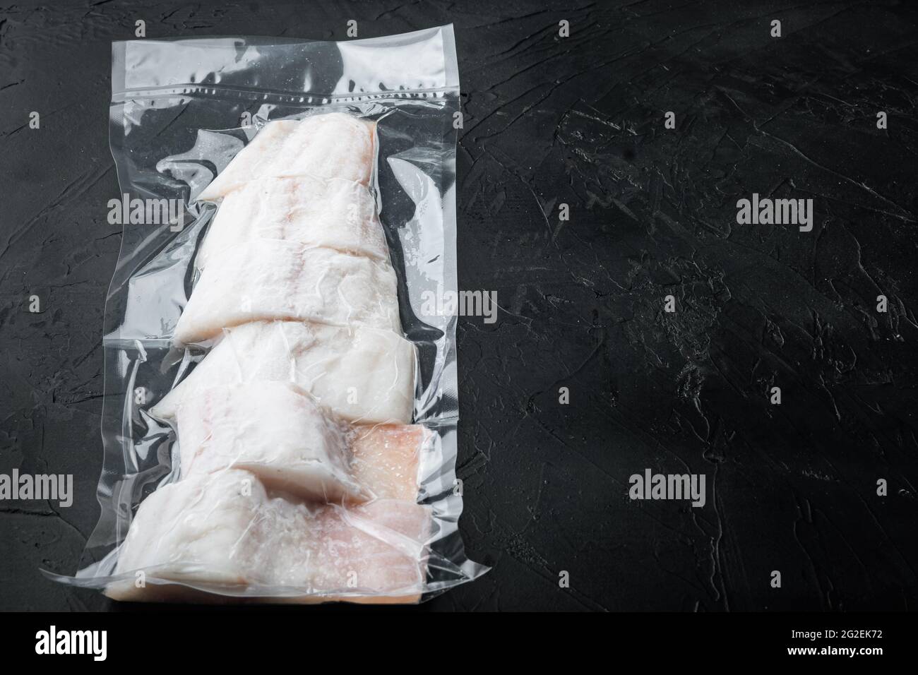 Haddock white fish fillet in plastic market package, top view with copy ...