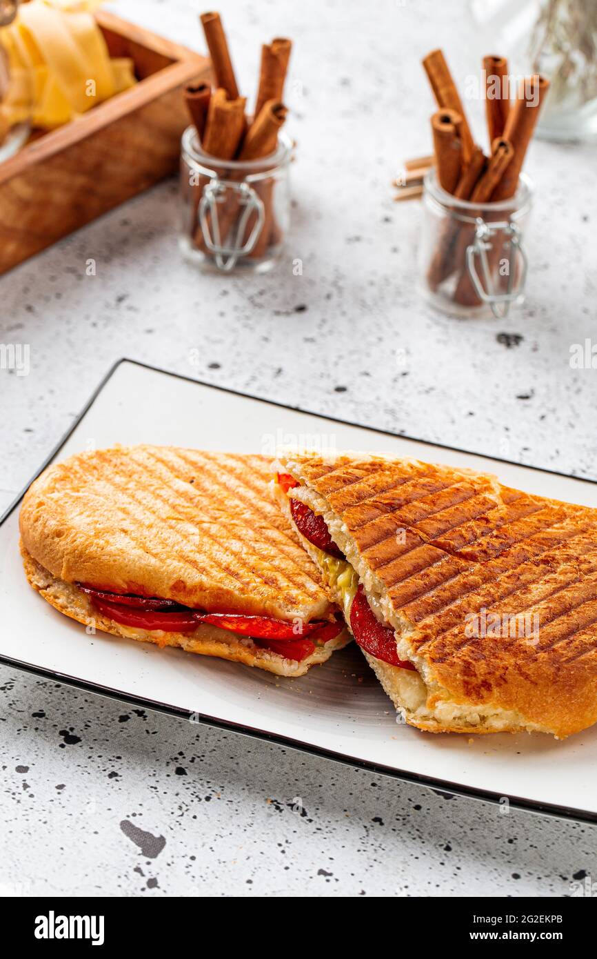 Fresh grilled panini pepperoni on light background Stock Photo - Alamy