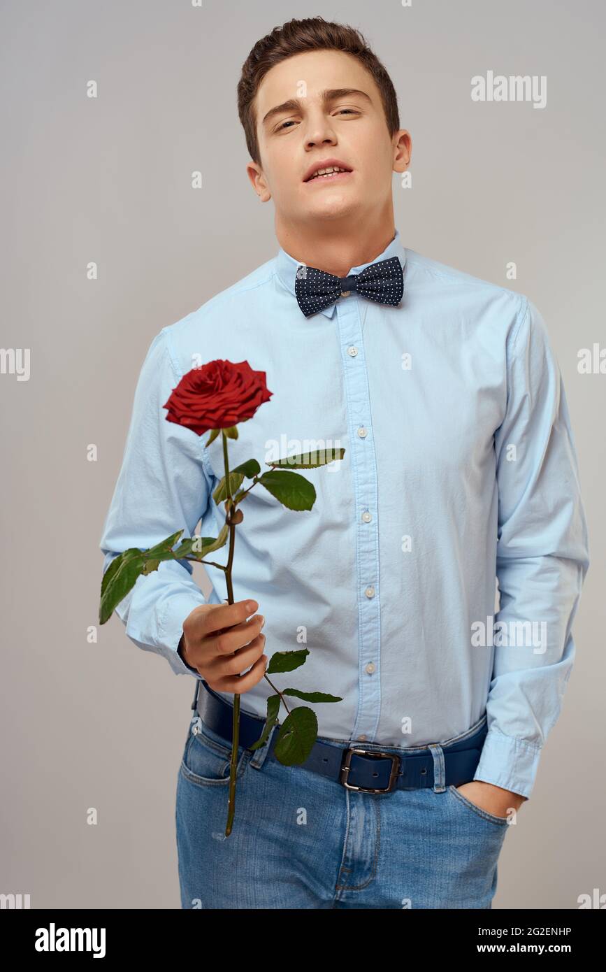 man wearing rose flower gift elegant style studio Stock Photo - Alamy