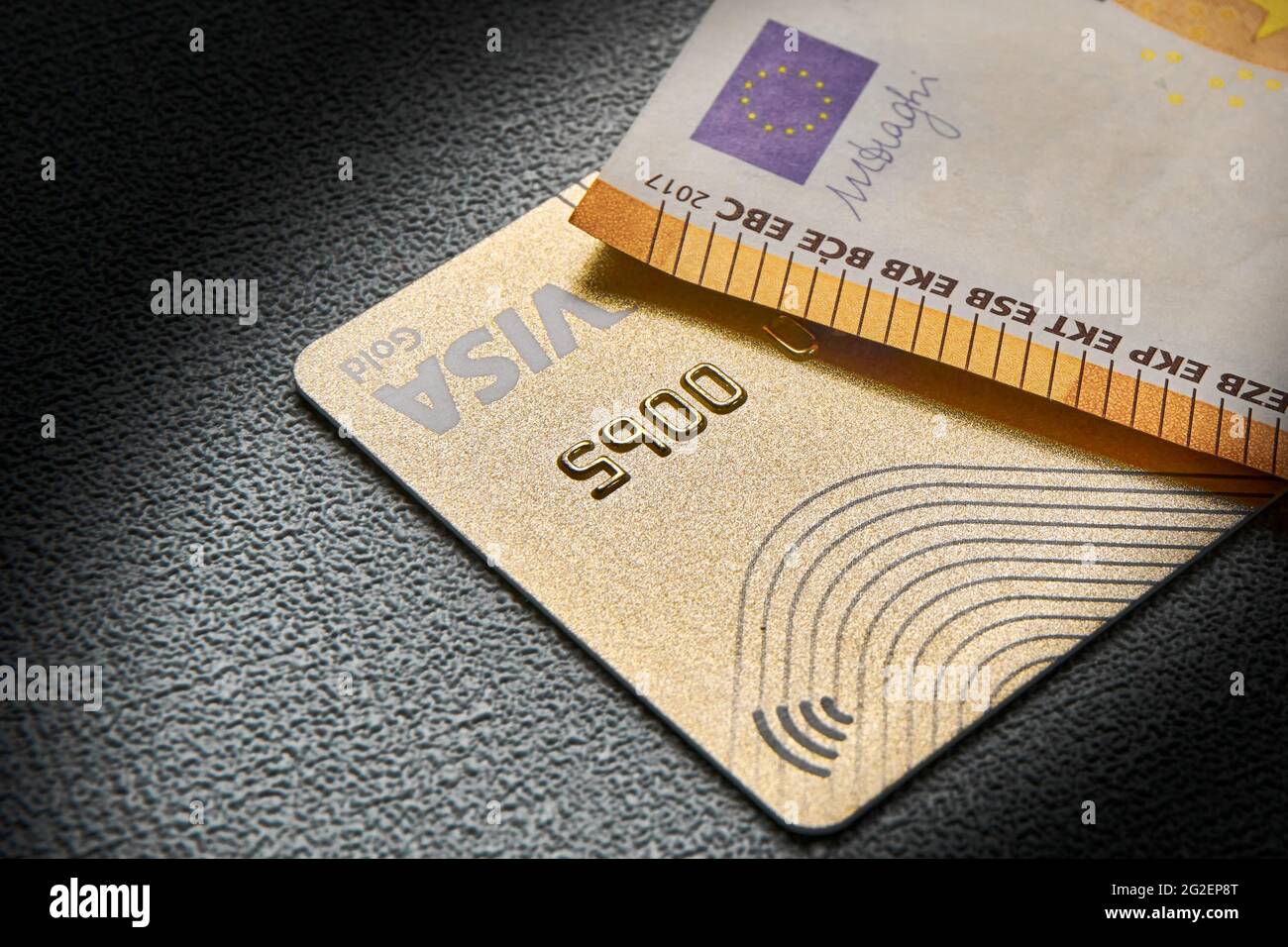 Ukraine - 06.11.2021: Gold colored bank card and cash Stock Photo - Alamy