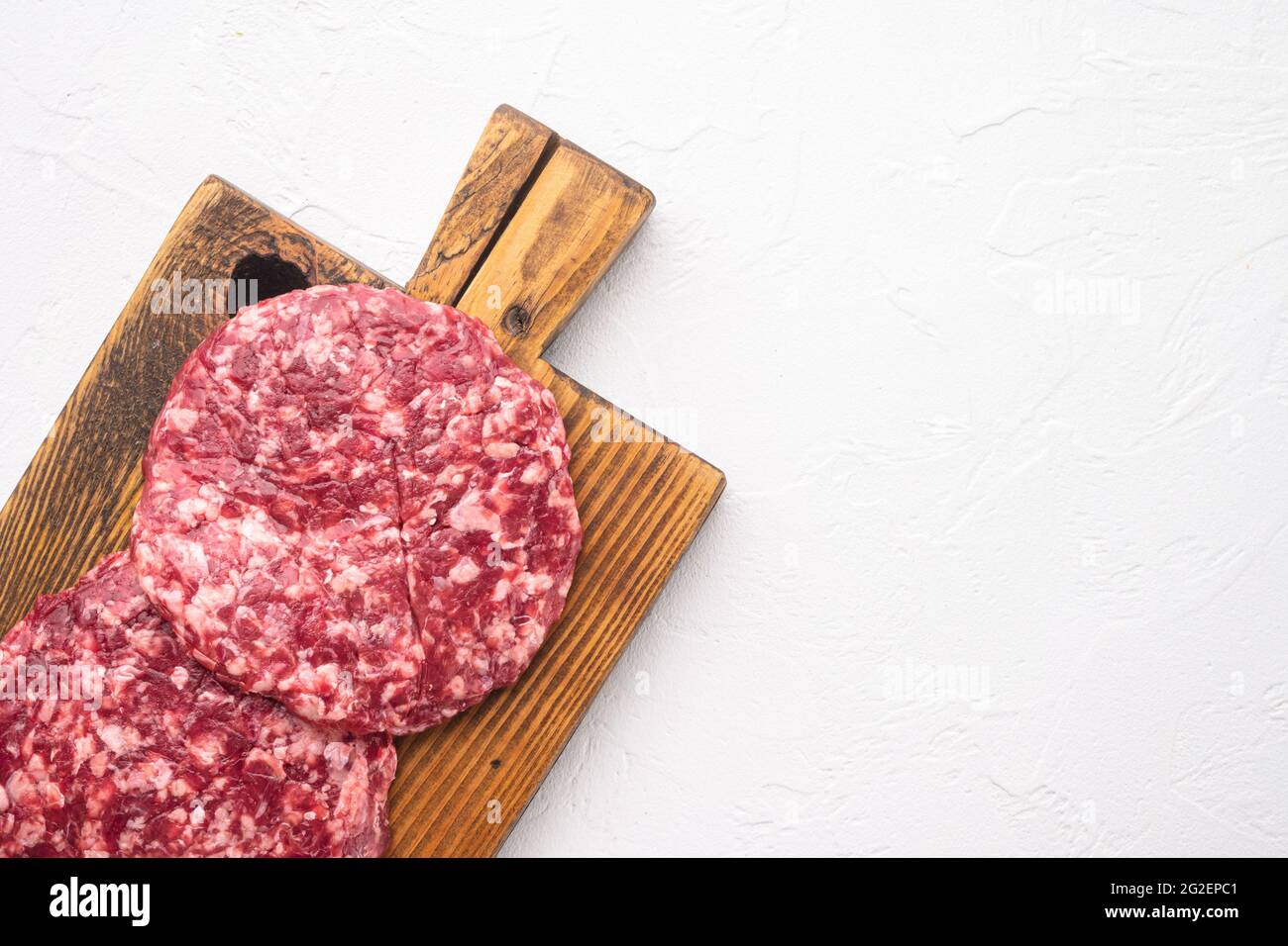 Raw Ground beef meat Burger steak cutlets set, on white stone ...