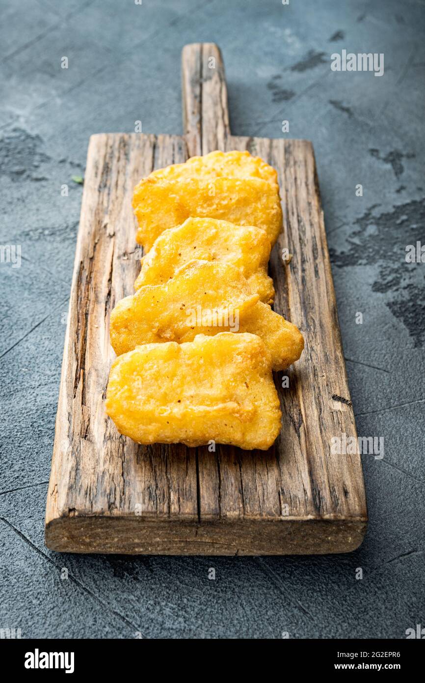 Homemade chicken nuggets fried on grey background Stock Photo - Alamy