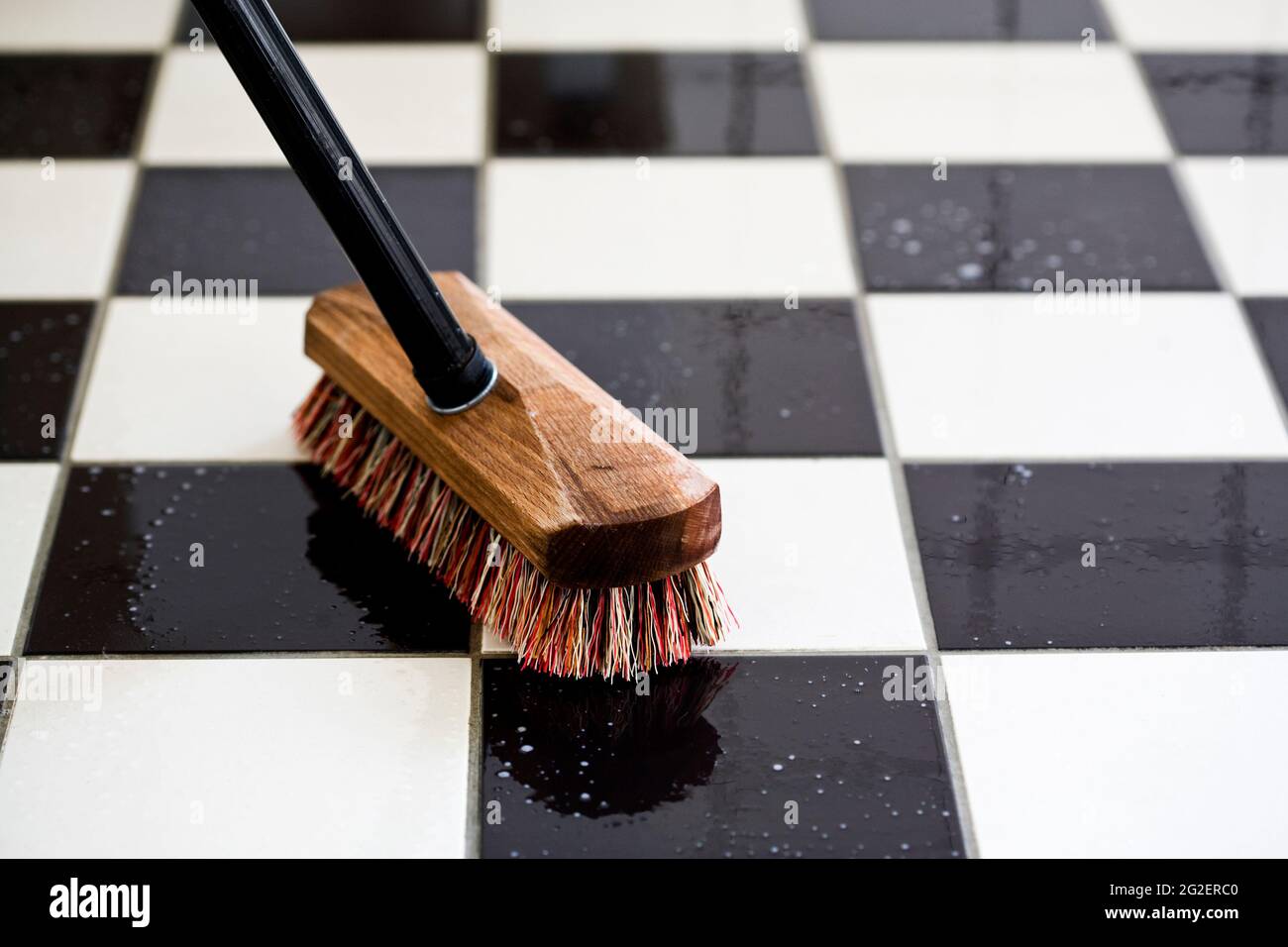 Scrubbing a tiled floor Stock Photo - Alamy