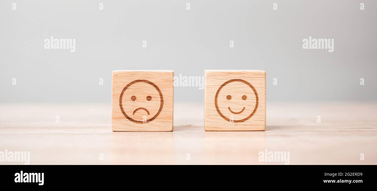 emotion face symbol on wooden blocks. Service rating, ranking, customer ...