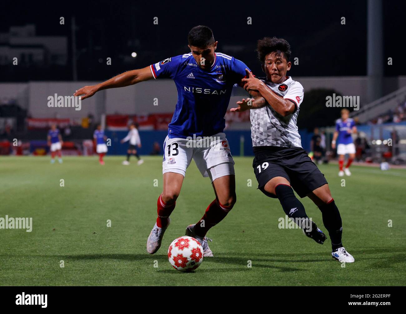 Kanagawa, Japan. 9th June, 2021. (L to R) Thiago Martins (F.Marinos), Kenshin Iwakiri (Honda FC ...