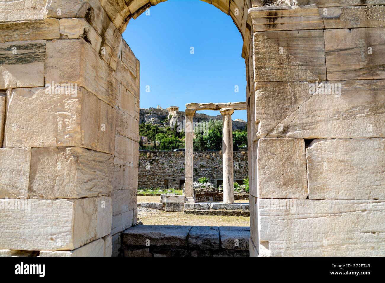 Ancient ruins in Hadrian's Library with a view to Acropolis in the ...