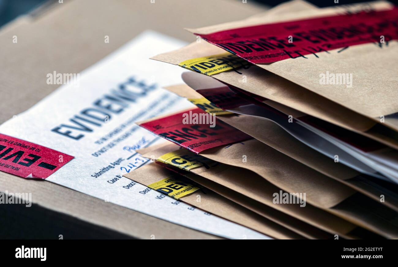 Files and evidence bag in a crime lab, conceptual image Stock Photo - Alamy