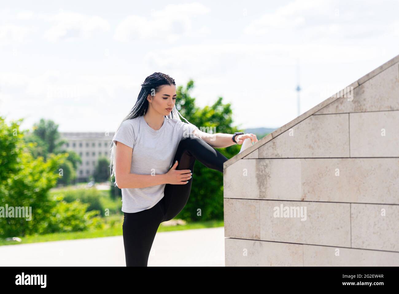 Fitness sport woman with african braids doing stretching exercise in ...