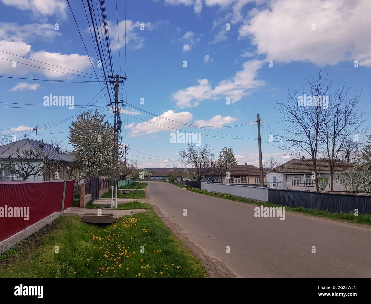 Countryside road with old cozy houses on both sides Stock Photo - Alamy