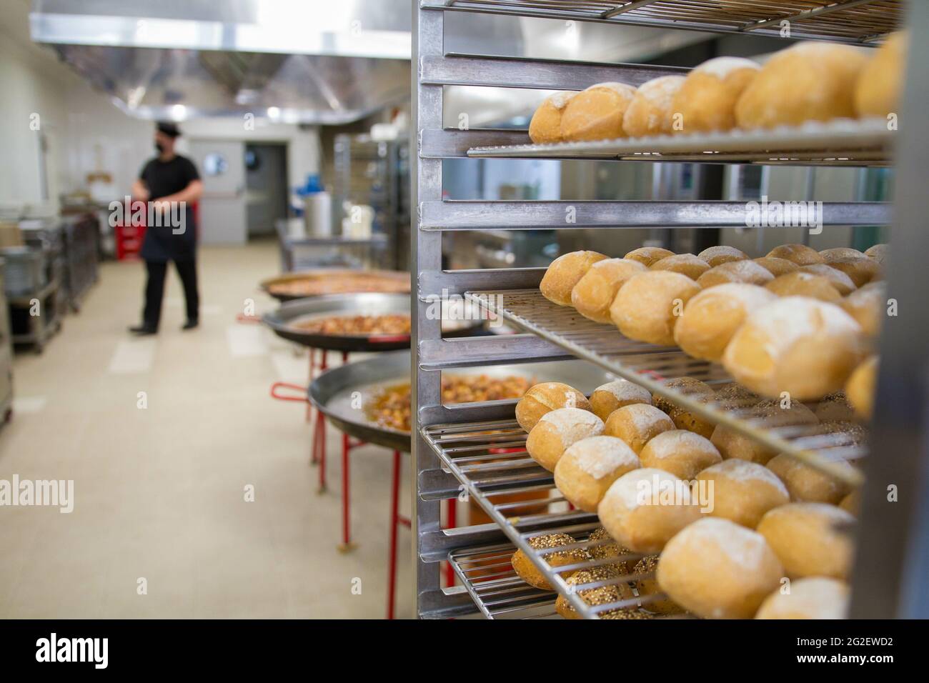 Baked buns on the shelves in a kitchen Stock Photo - Alamy