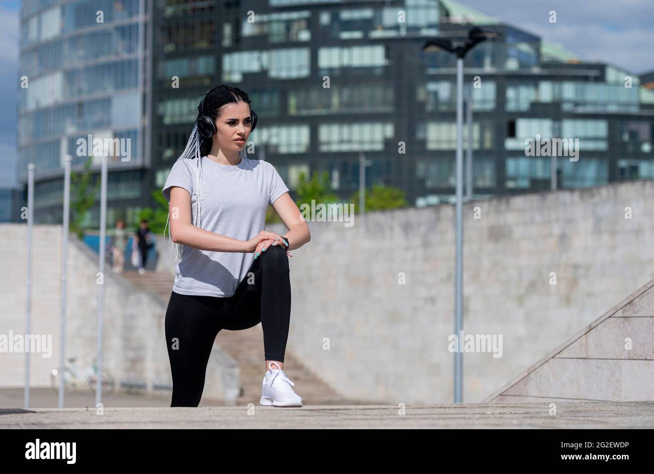 Fitness sport woman with african braids doing stretching exercise in ...
