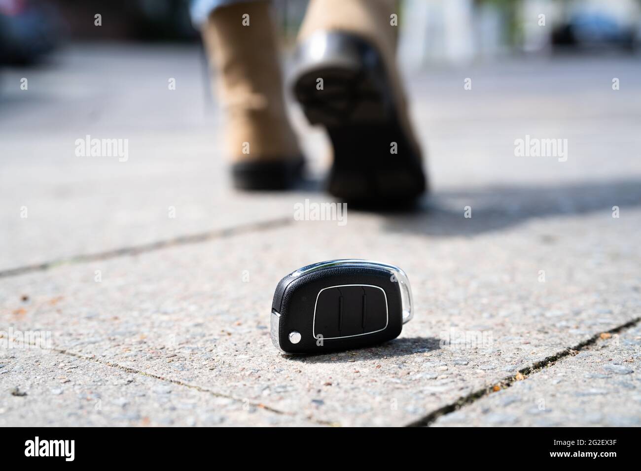 Woman Lost Car Key. Walking On Street Stock Photo - Alamy