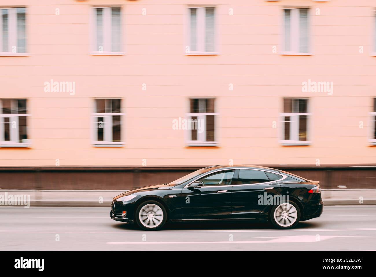 Black Color Tesla Model S Car In Motion On Street. The Tesla Model S Is ...