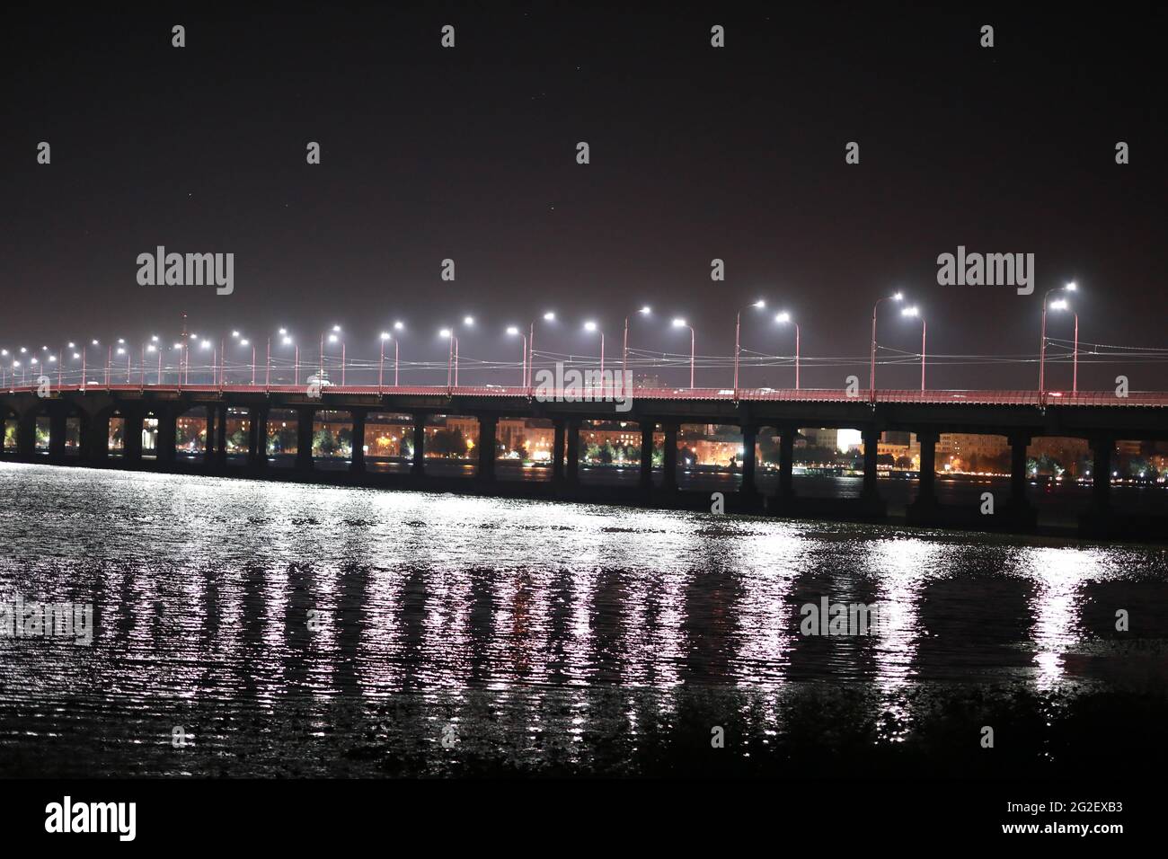 A train crossing a bridge over a body of water Stock Photo - Alamy